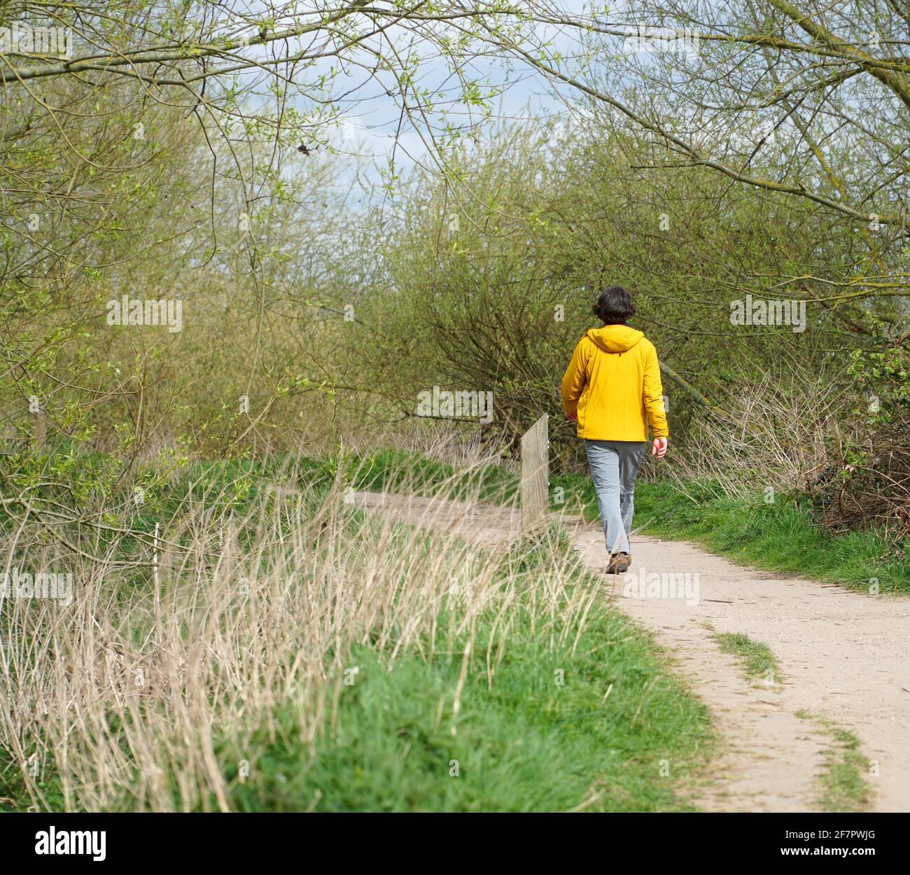 Boy walking away coat hi-res stock photography and images - Alamy