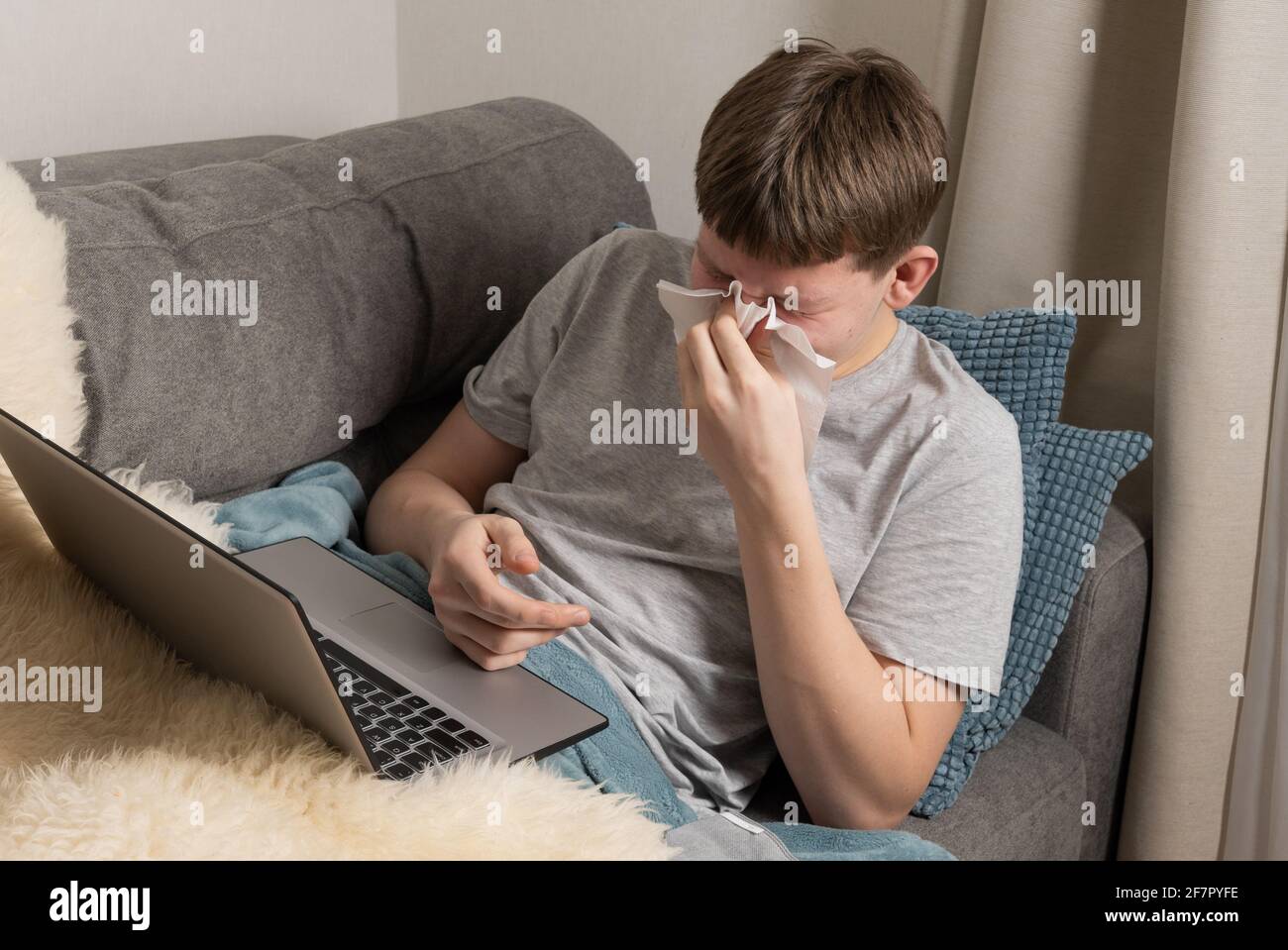 Teenager tries to study online and sneezes into paper towel. Self ...