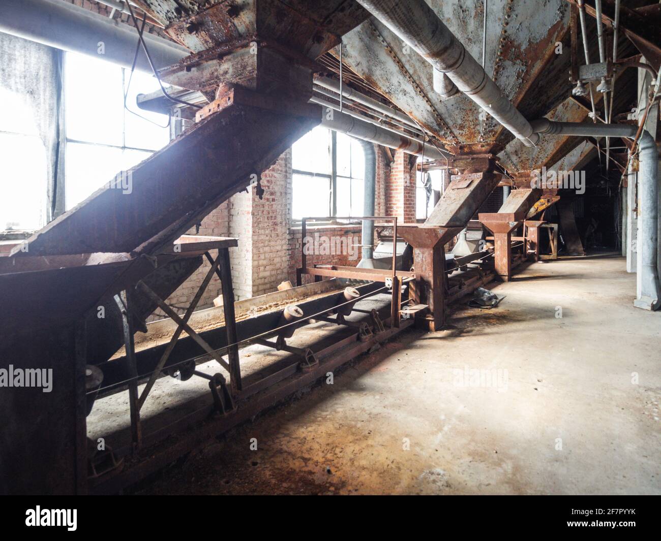 inside an abandoned factory with bright light coming inside Stock Photo ...