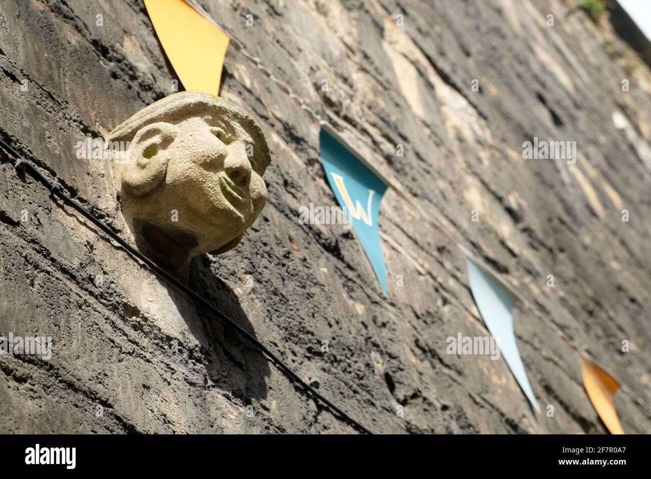 Carved figures on the wall in Walcot St Bath somerset UK Stock Photo ...