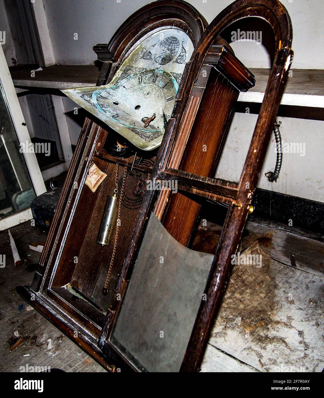 old abandoned and broken clock on the ground Stock Photo - Alamy