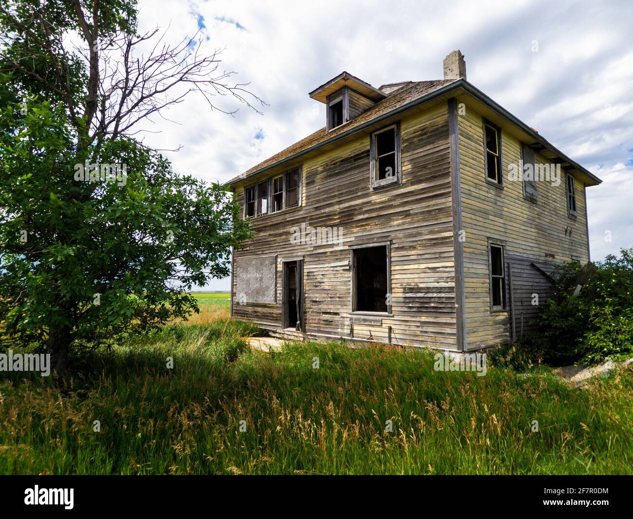 view of a two story house in a rural setting in summer Stock Photo - Alamy