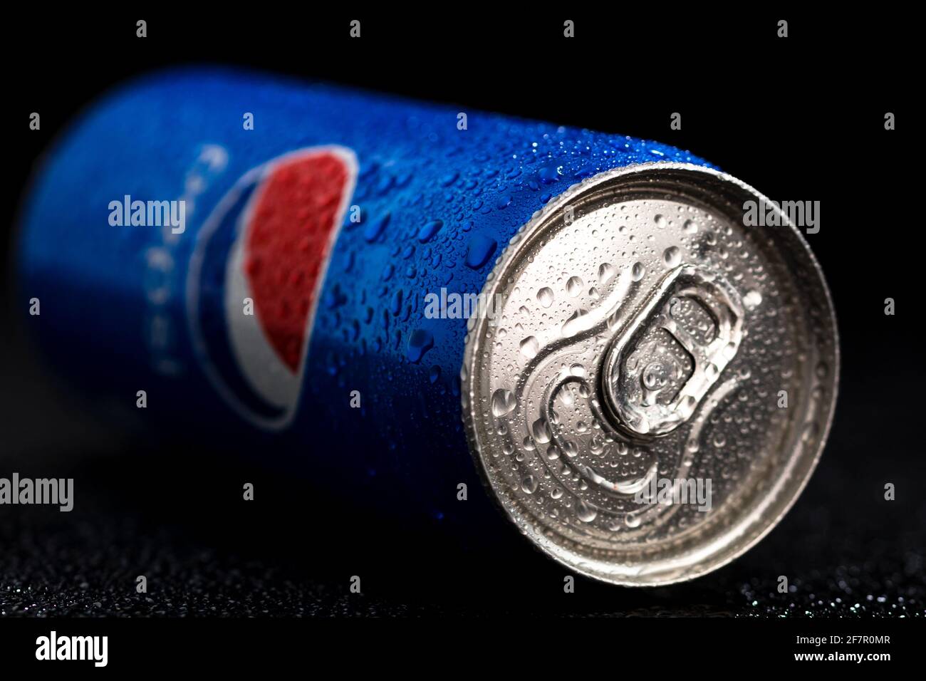 Editorial photo of Pepsi can with water droplets on black background ...