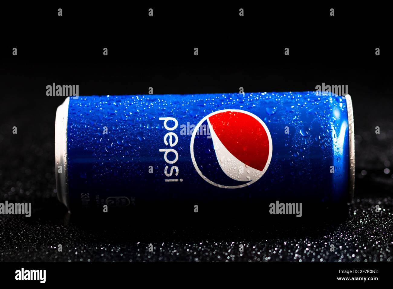 Editorial photo of Pepsi can with water droplets on black background ...
