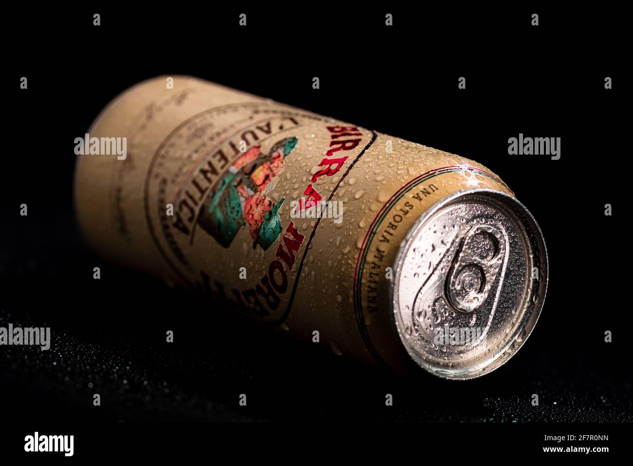 Birra Moretti, a premium lager beer with water droplets on black ...