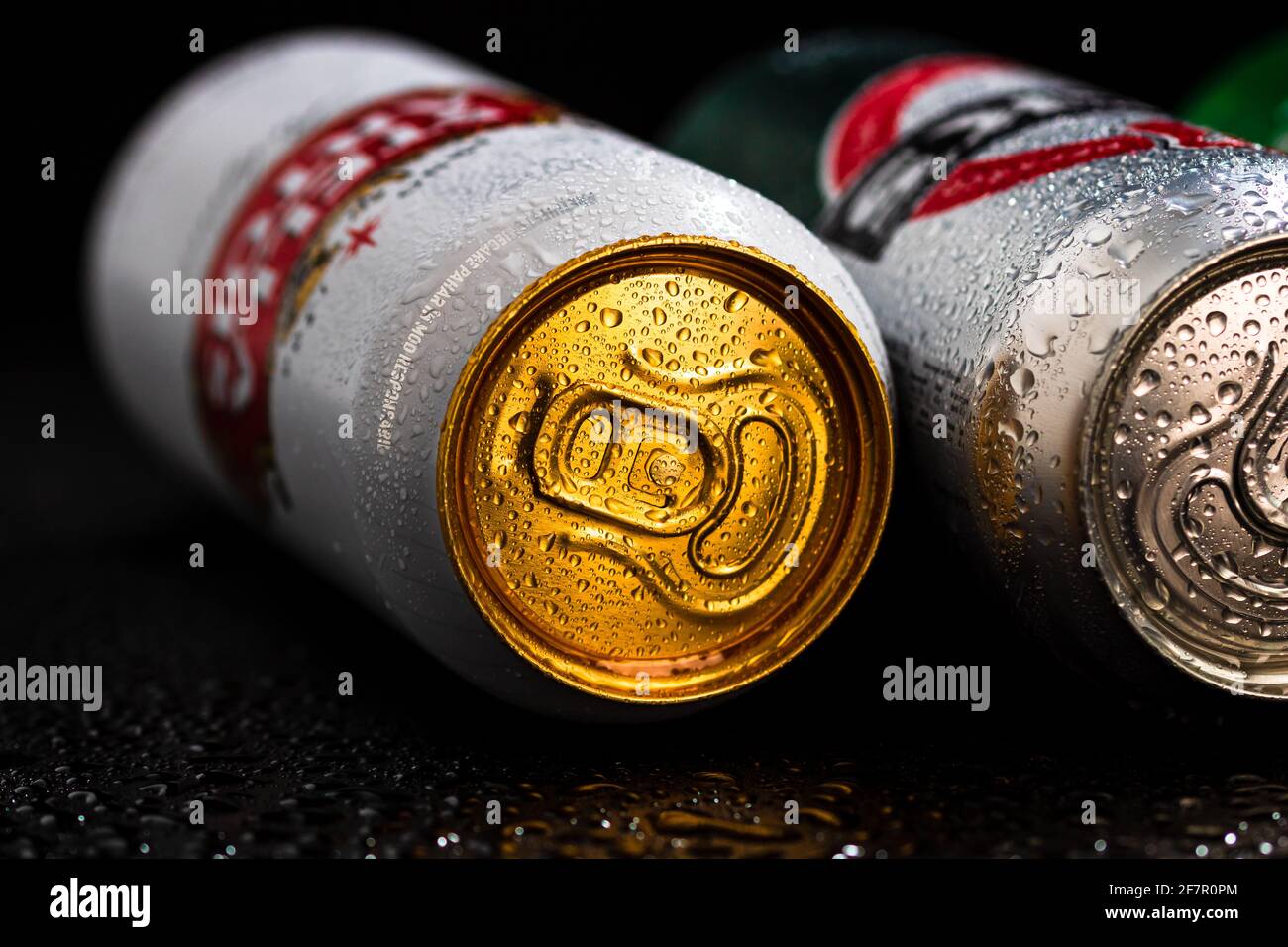 Condensation water droplets on beer cans isolated on black. Bucharest ...