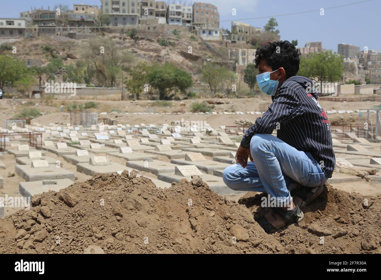 Taiz Yemen - 03 Apr 2021 : A Yemeni in a cemetery for the dead due to ...