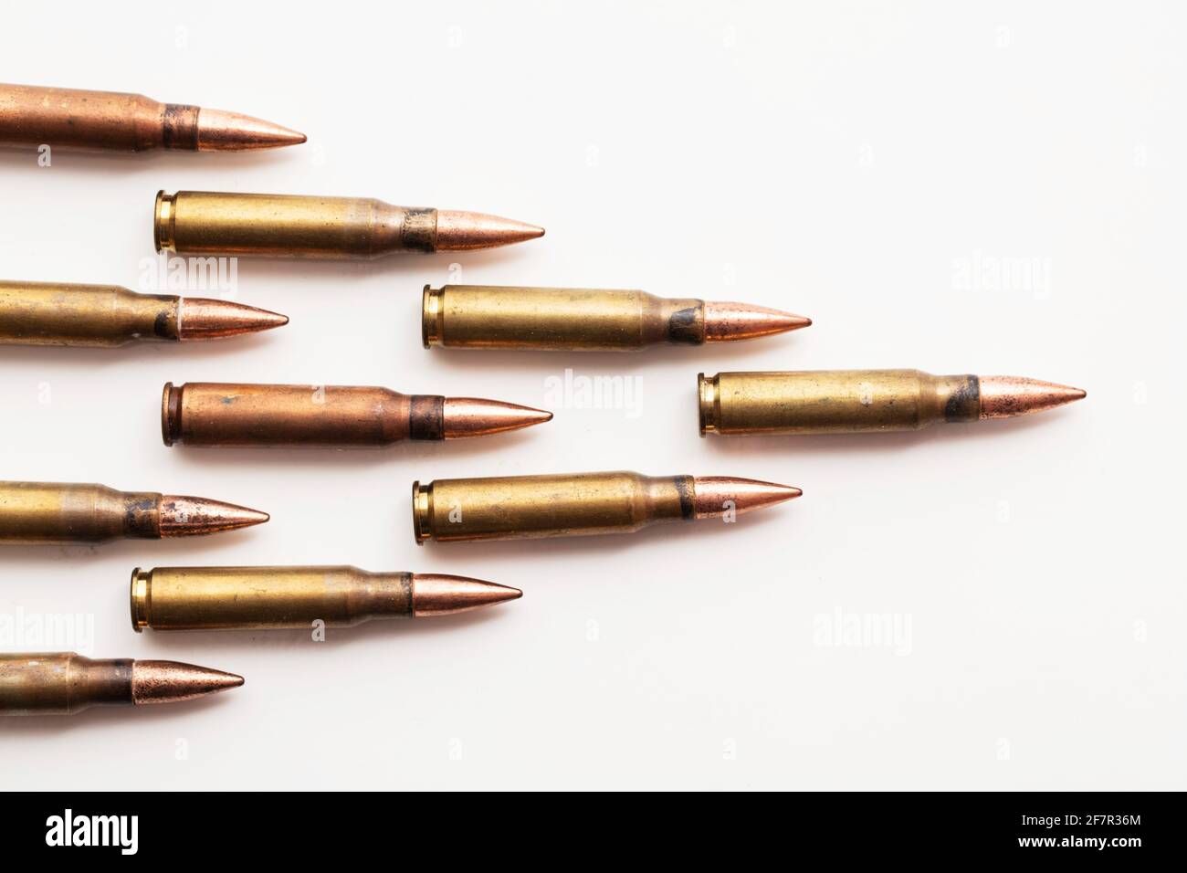A group of bullet ammunition shells on a white background Stock Photo ...