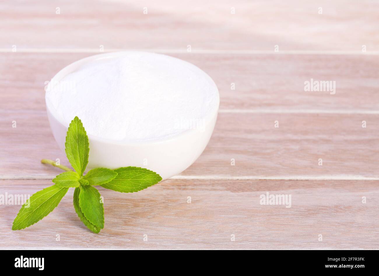 Fresh green Stevia herb and extract powder - Stevia rebaudiana. white ...