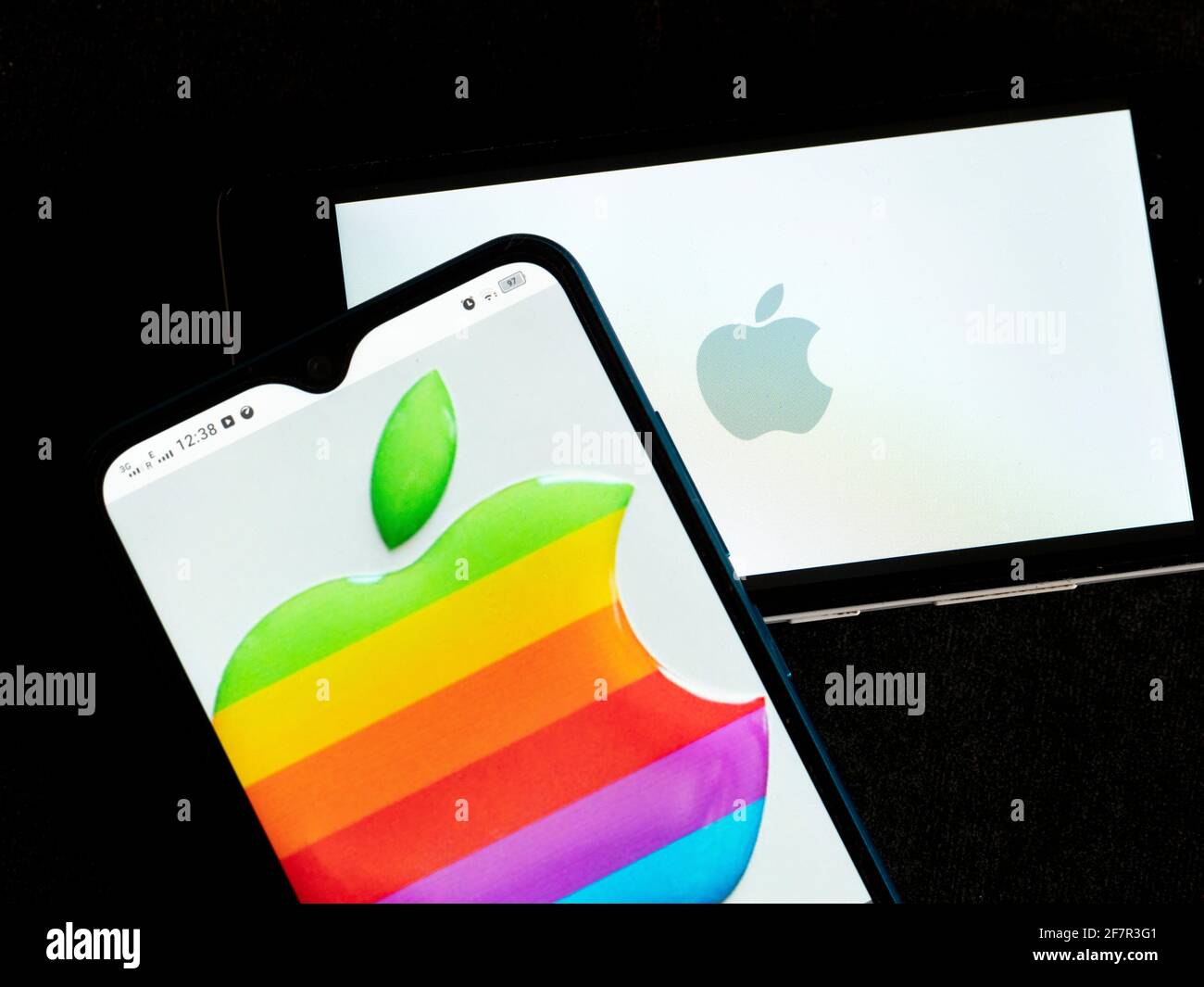 In this photo illustration, Apple logos seen displayed on smartphones ...