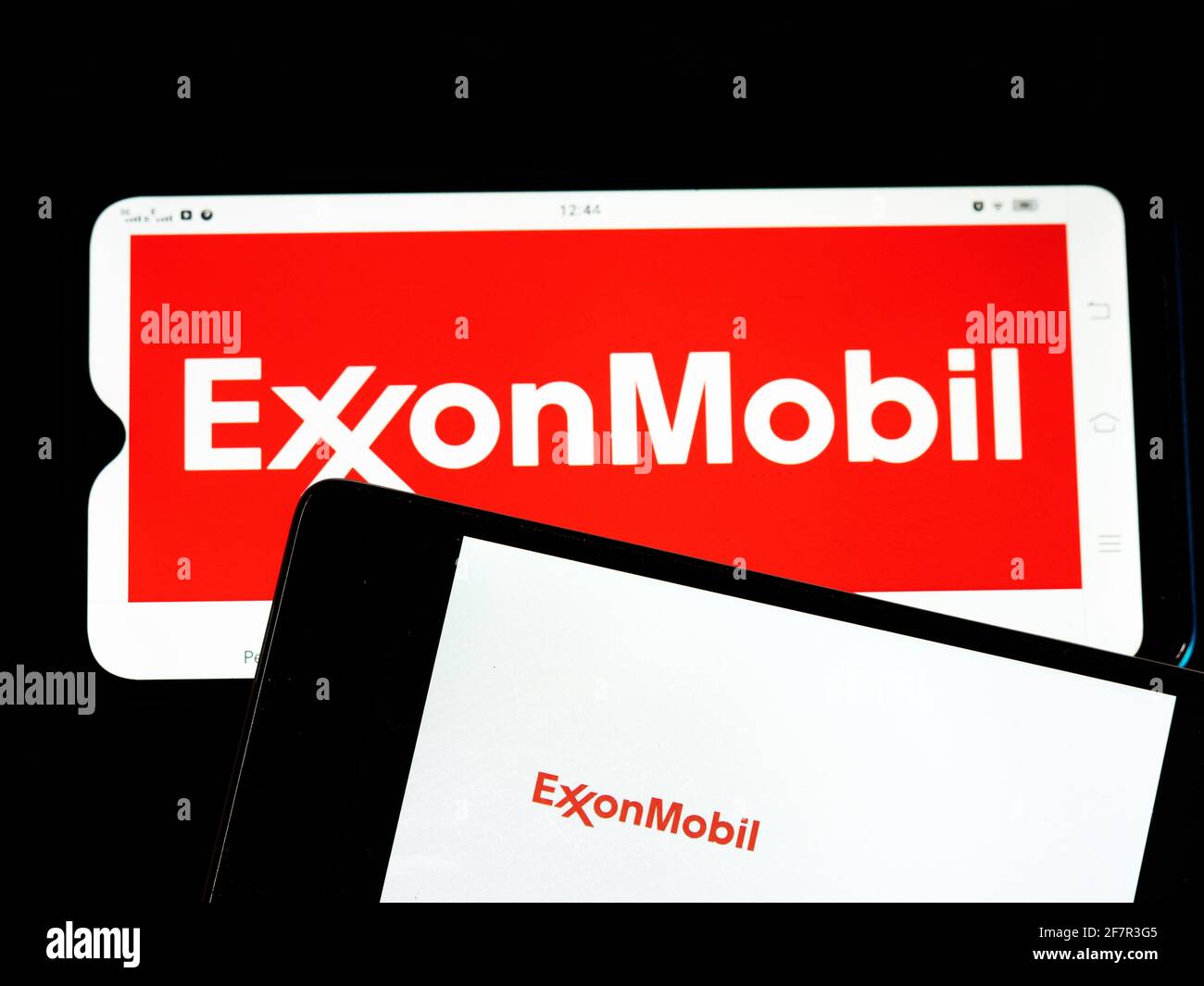 In this photo illustration, Exxon Mobil logos seen displayed on ...