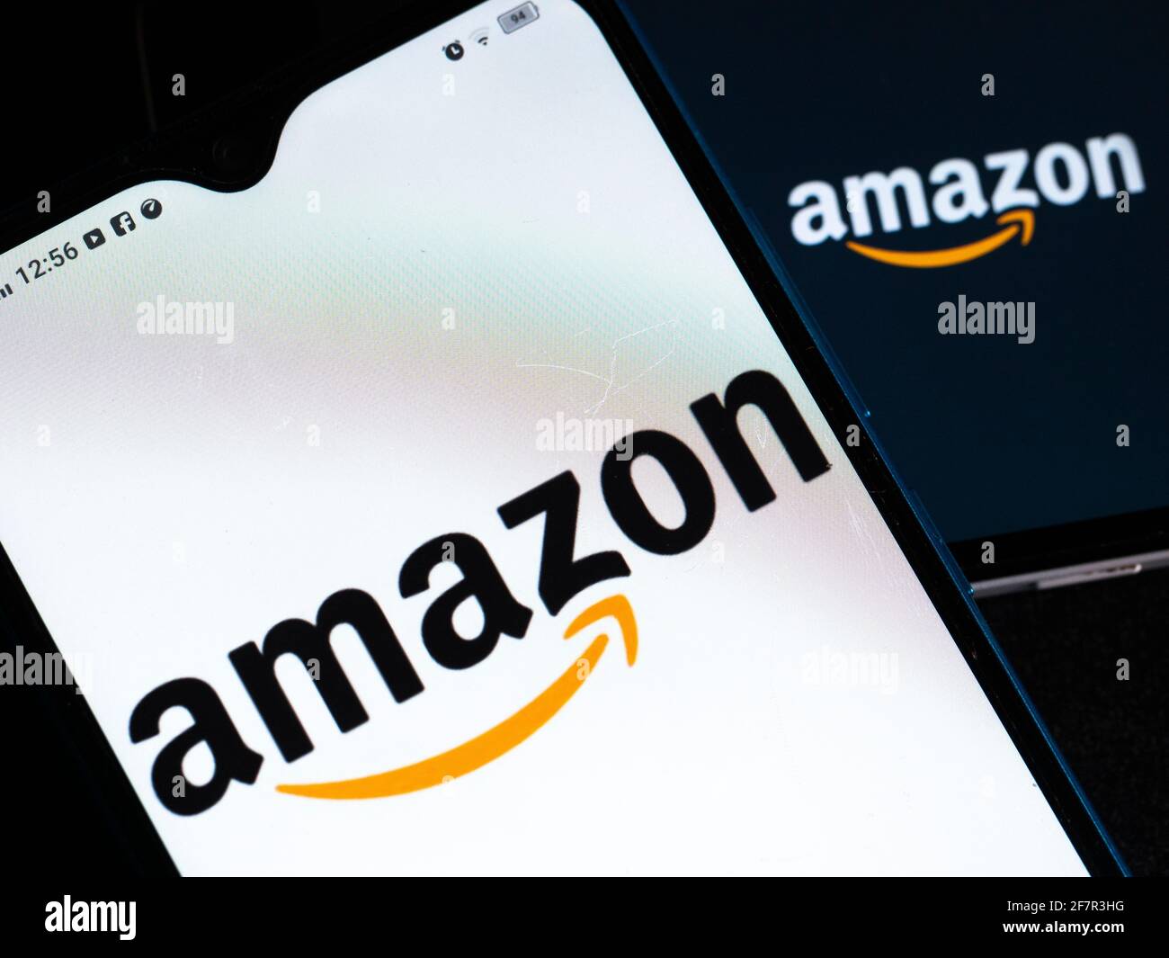 In this photo illustration, Amazon logos seen displayed on smartphones ...