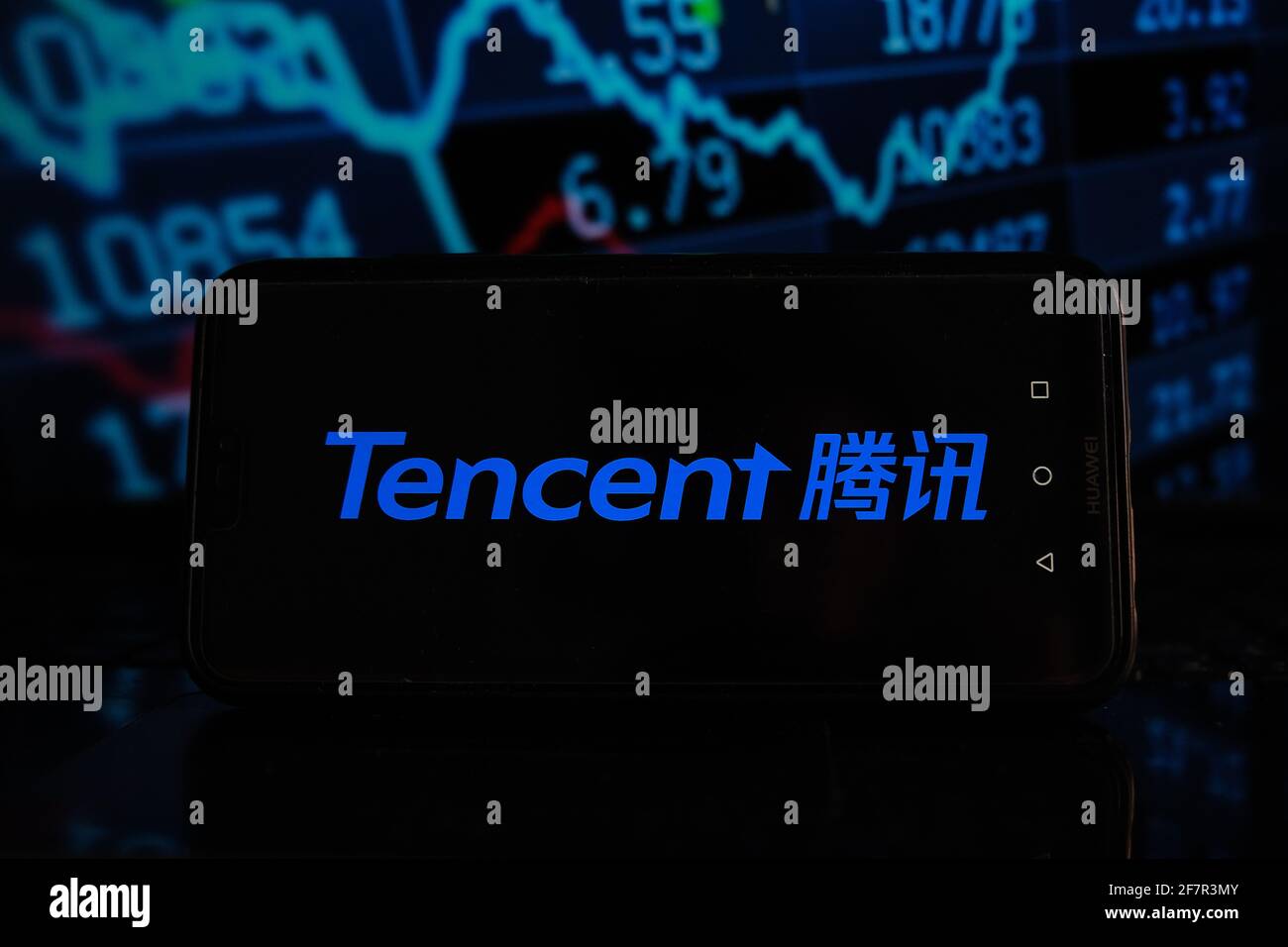 In this photo illustration a Tencent logo seen displayed on a ...