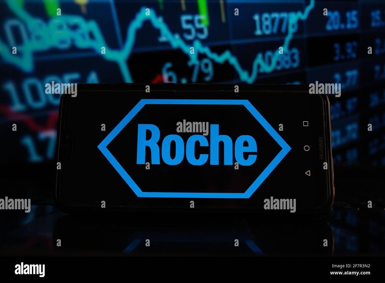 In this photo illustration a Roche logo seen displayed on a smartphone ...