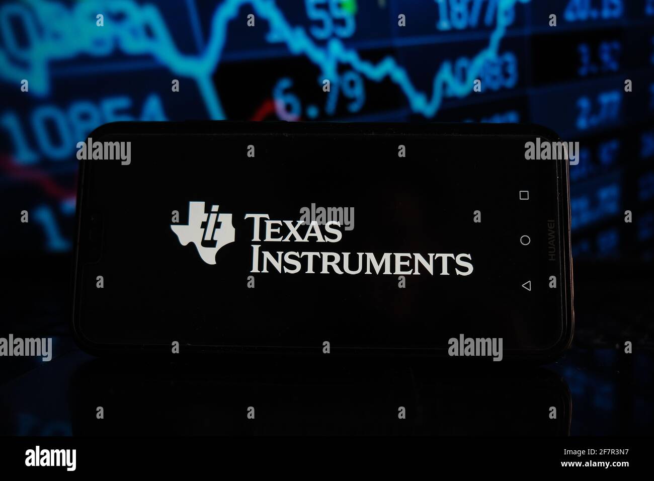 In this photo illustration a Texas Instruments logo seen displayed on a ...