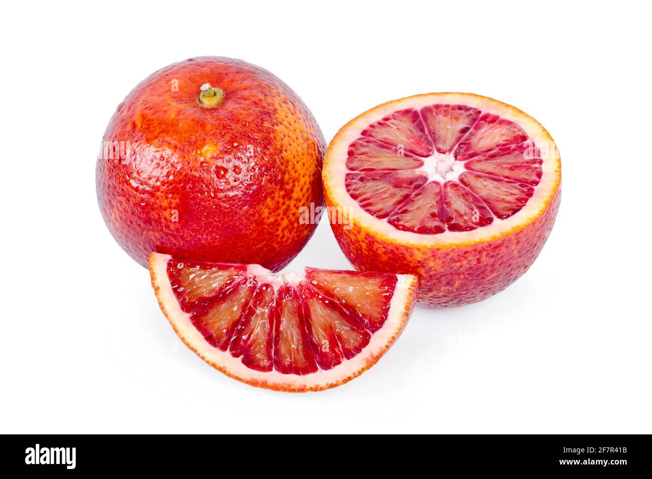 Bloody oranges whole and and cut in half isolated on white background ...
