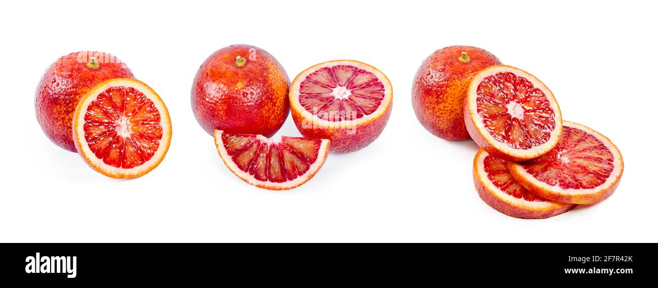 Bloody oranges whole, cut in half and sliced isolated on white ...