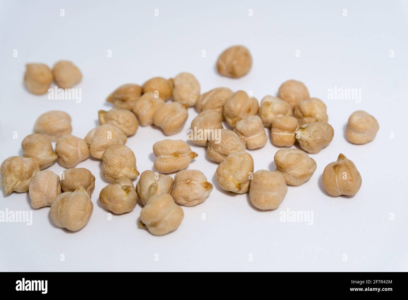 A close up shot of chickpeas in studio settings.Chickpeas, also known ...
