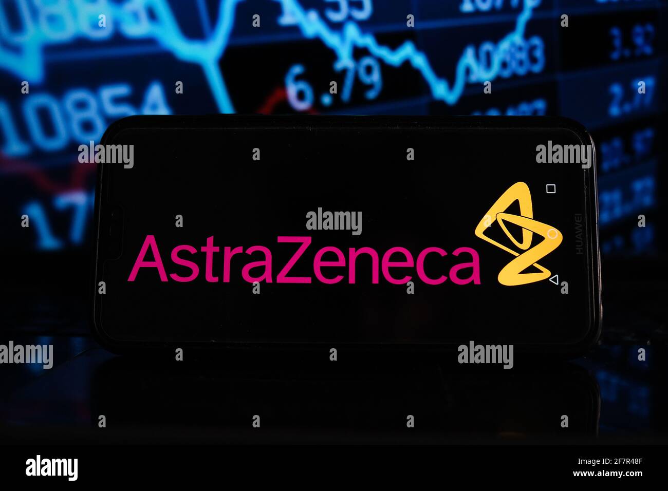 In this photo illustration an AstraZeneca logo seen displayed on a ...