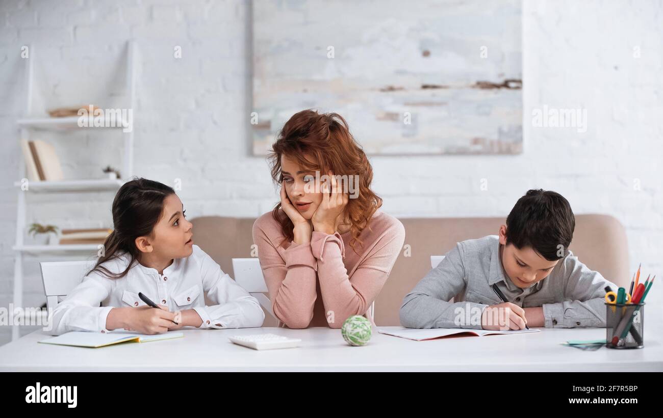 Kids doing homework table hi-res stock photography and images - Alamy