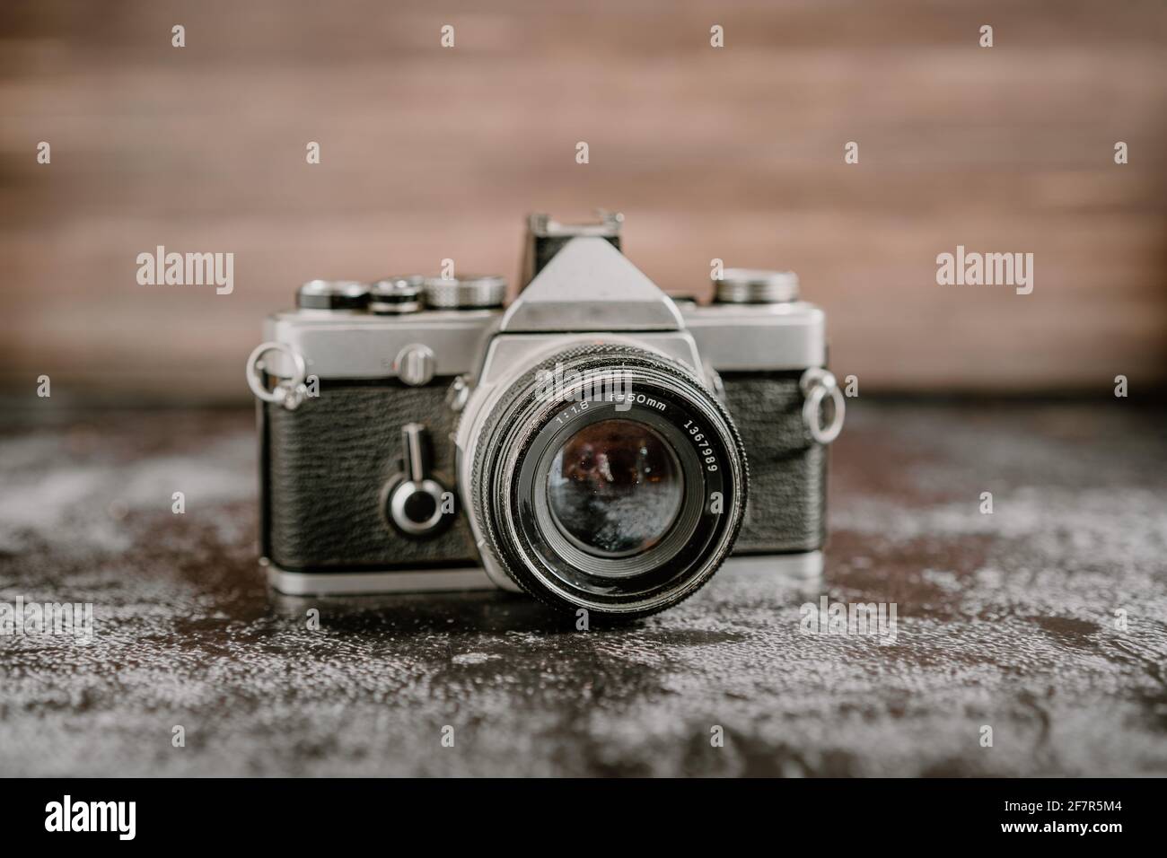 Dark product photography of a old film retro camera with shallow depth ...