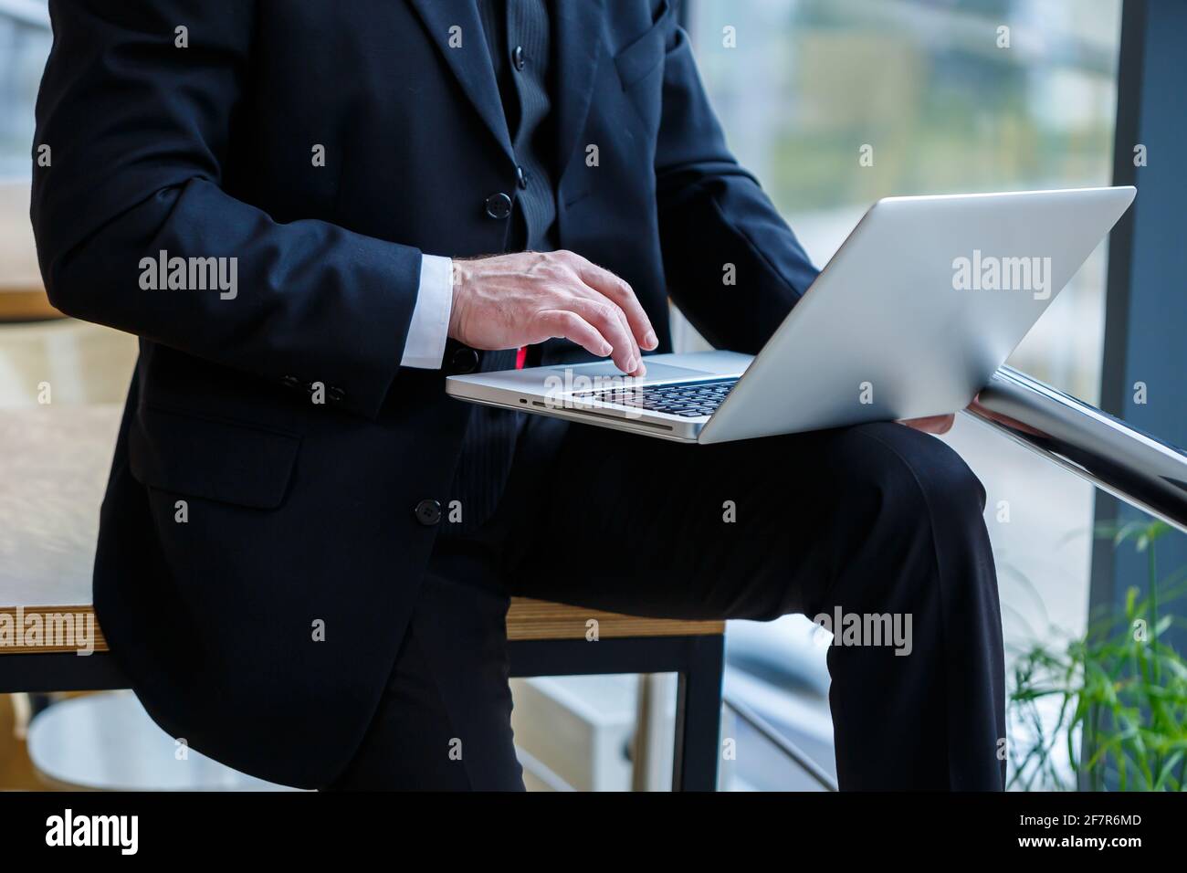 Smiling happy managing director thinks about his successful career ...