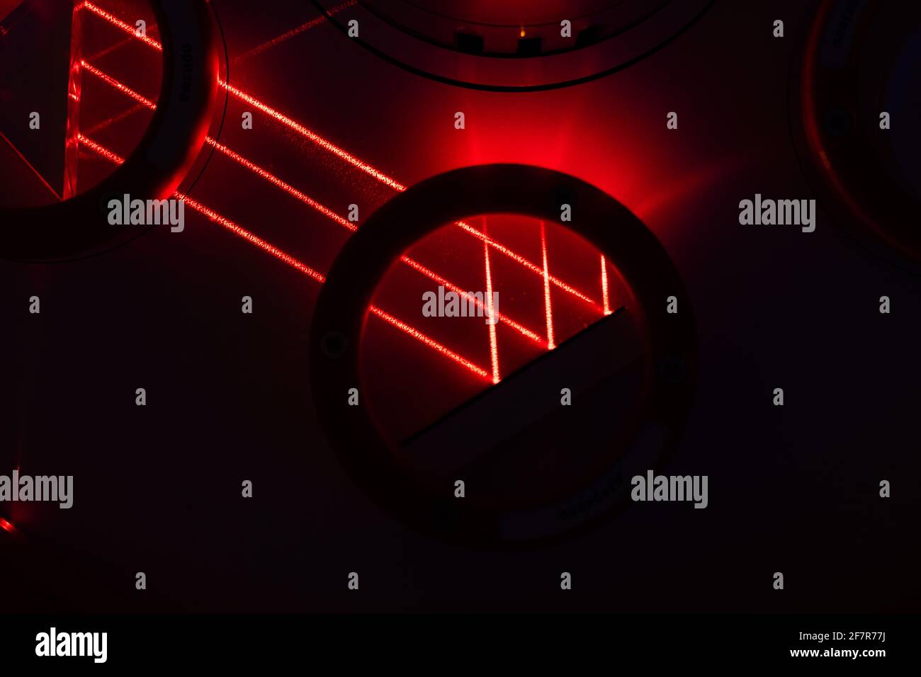 Dark street, reflection of neon light on wet asphalt. Rays of light and ...