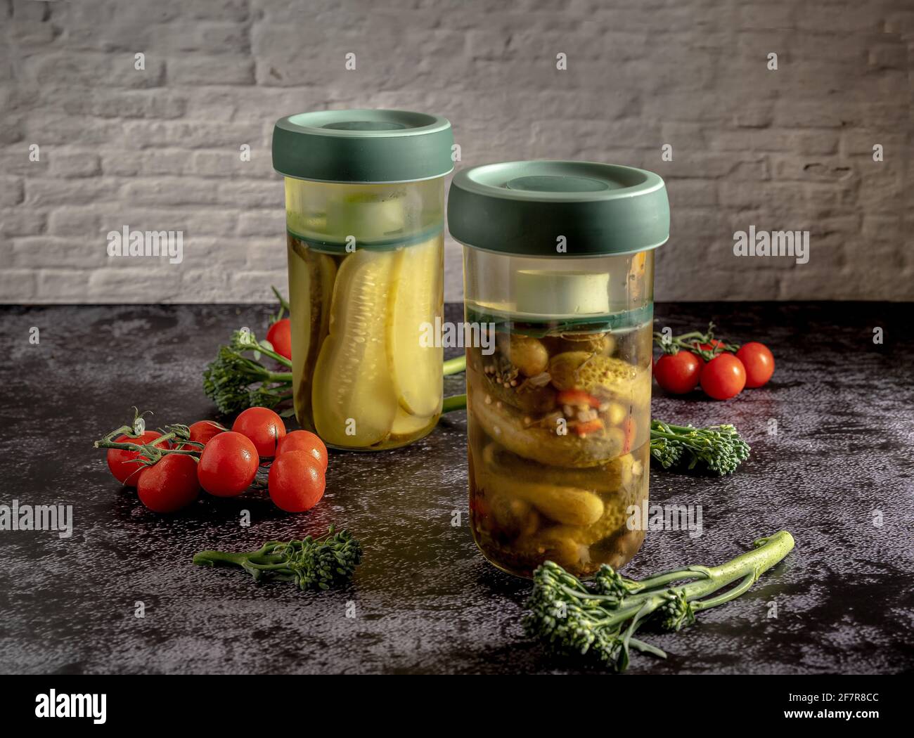 Retro food photography of a press jars with homemade fermented pickles ...