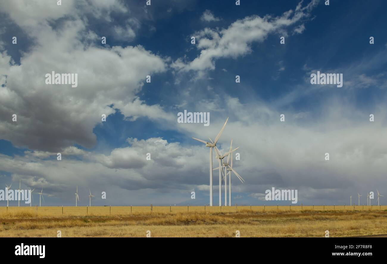 Wind turbines windmill energy farm in West Texas plains under a blue ...