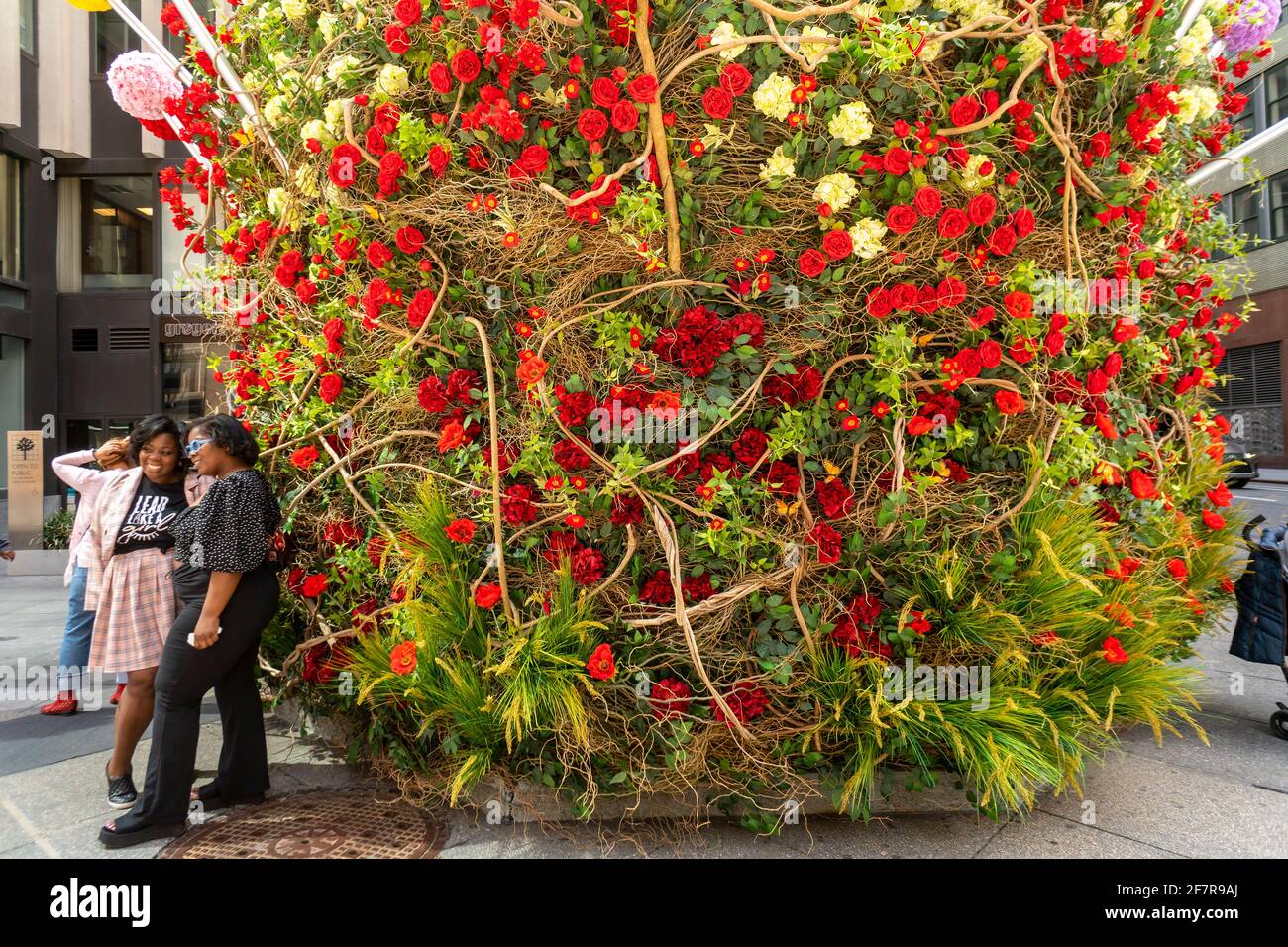 Visitors to the Garment District in New York interact with the floral ...