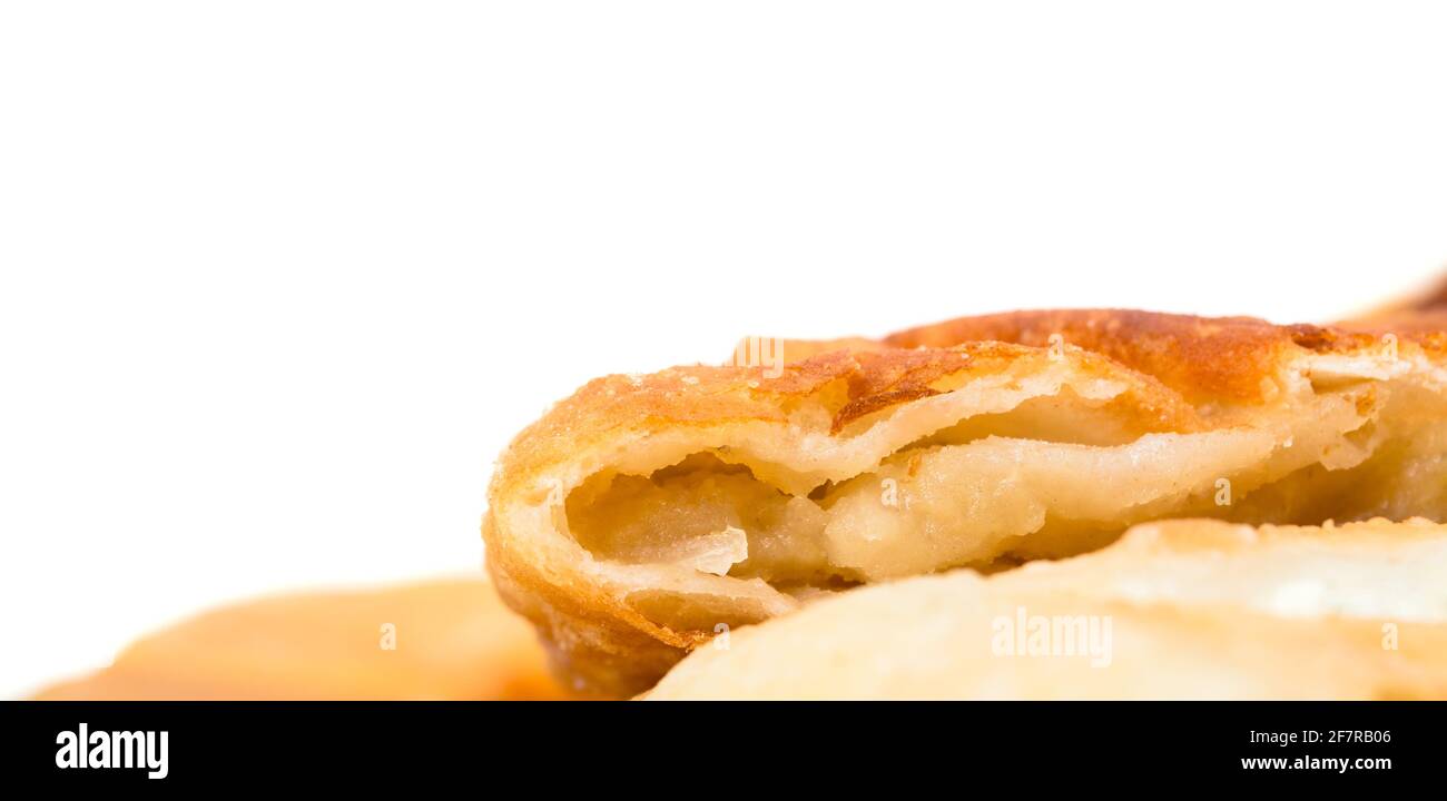 Delicious sliced puff pie with potatoes. Macro. Photo can be used as a ...
