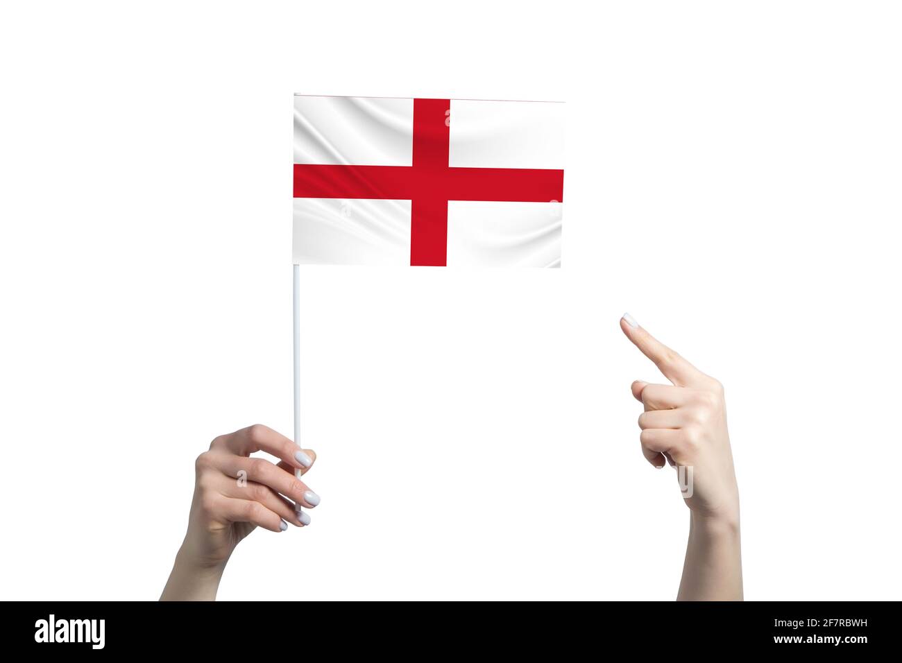A beautiful female hand holds a England flag to which she shows the ...