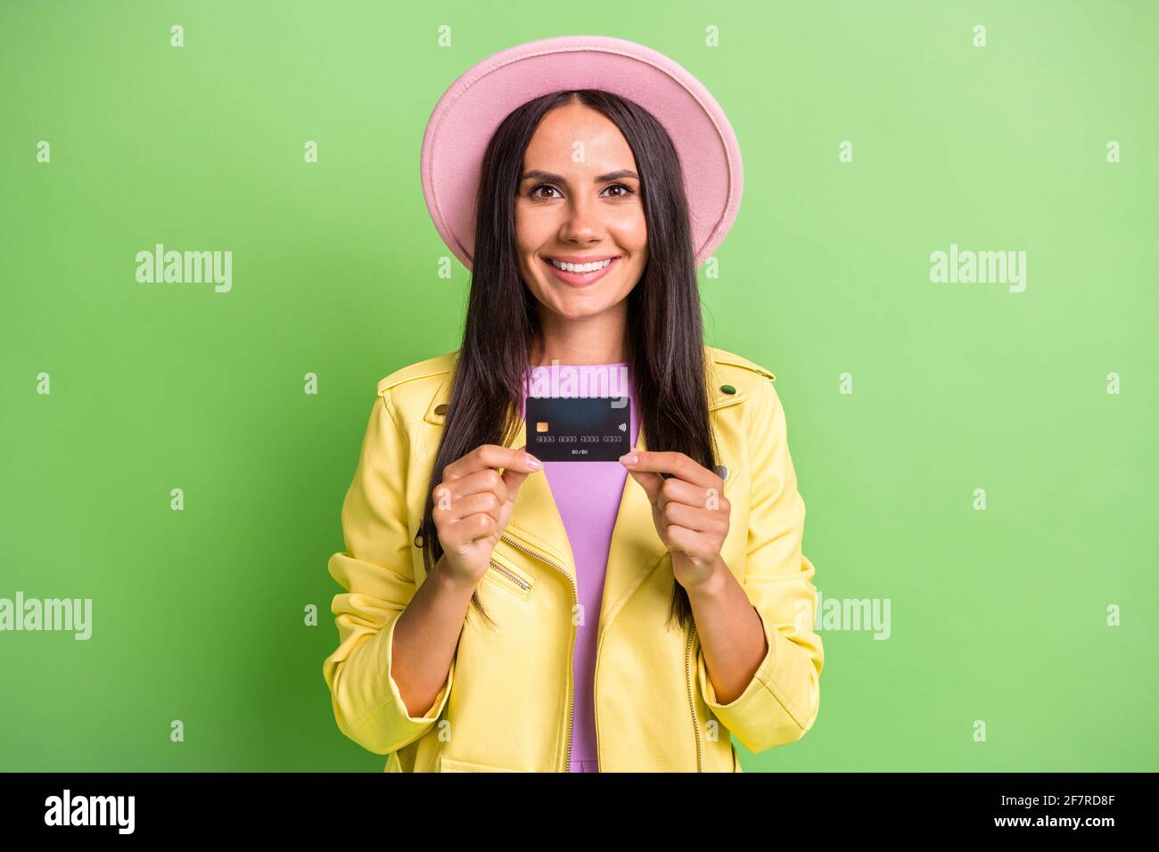 Photo of girl demonstrate credit card toothy smile wear yellow jacket ...