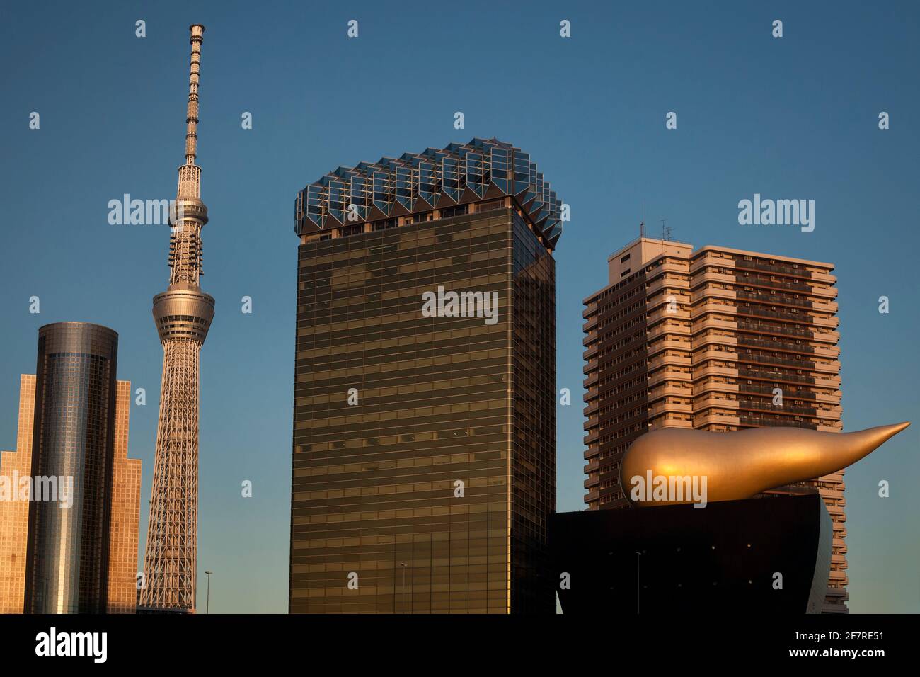 Horizontal close-up view of the Tokyo Sky Tree and the Asahi Flame at ...