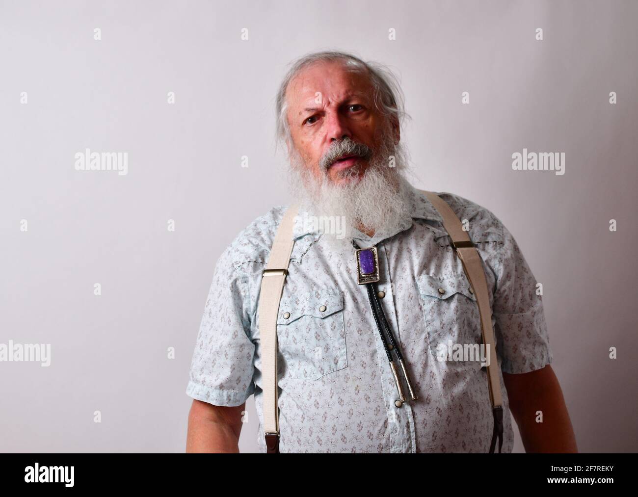 Senior Caucasian bearded male with a serious expression showing ...