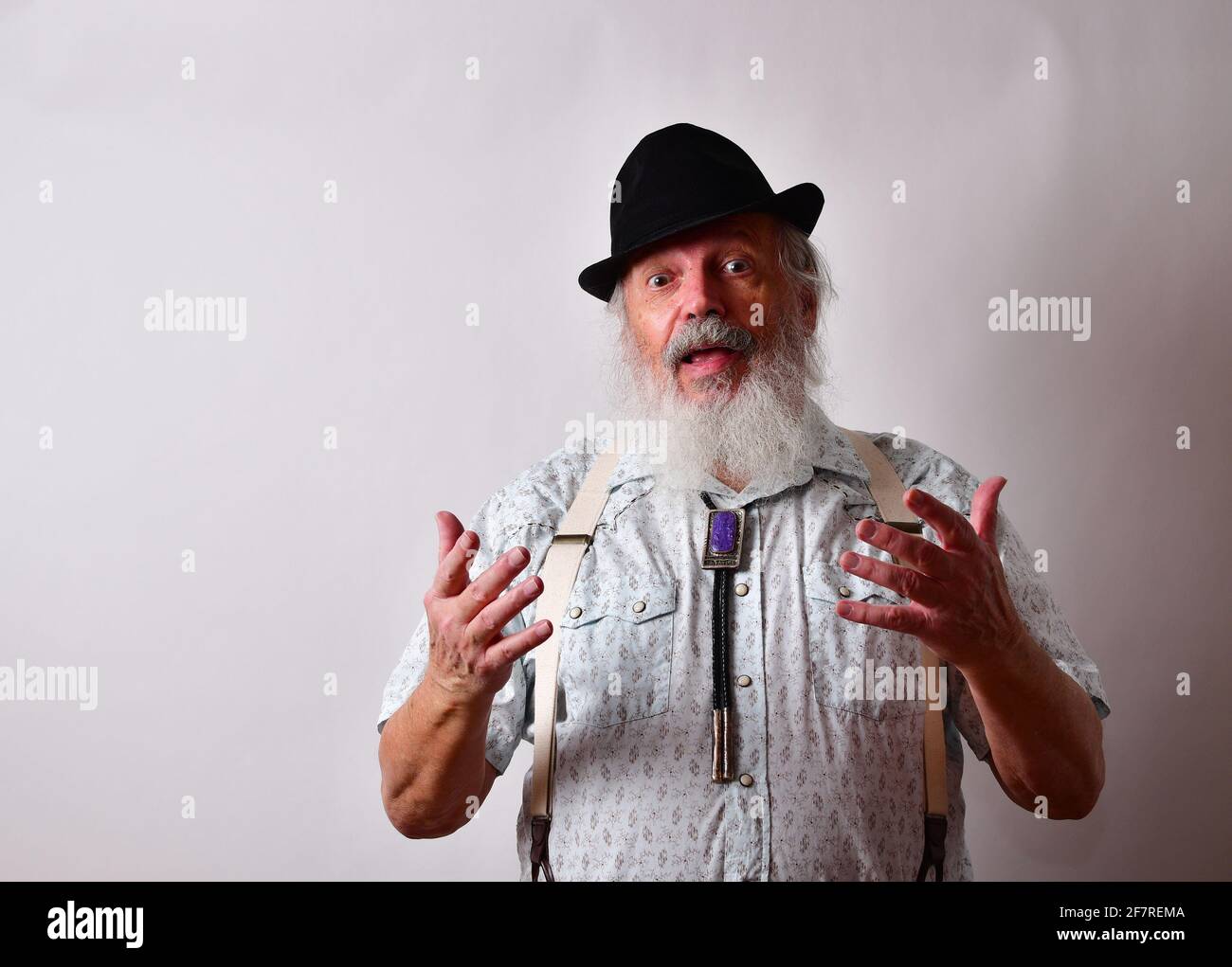 Senior Caucasian bearded male with a serious expression showing ...