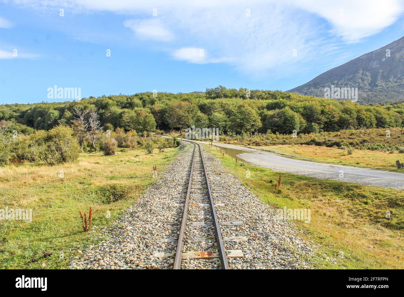 Beautiful landscape of a railway track in a rural countryside fading ...