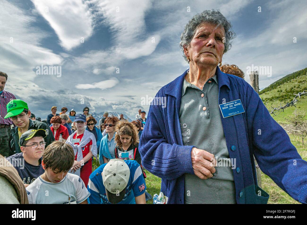 Pilgrims marching to the sanctuary carrying the devotional banner ...