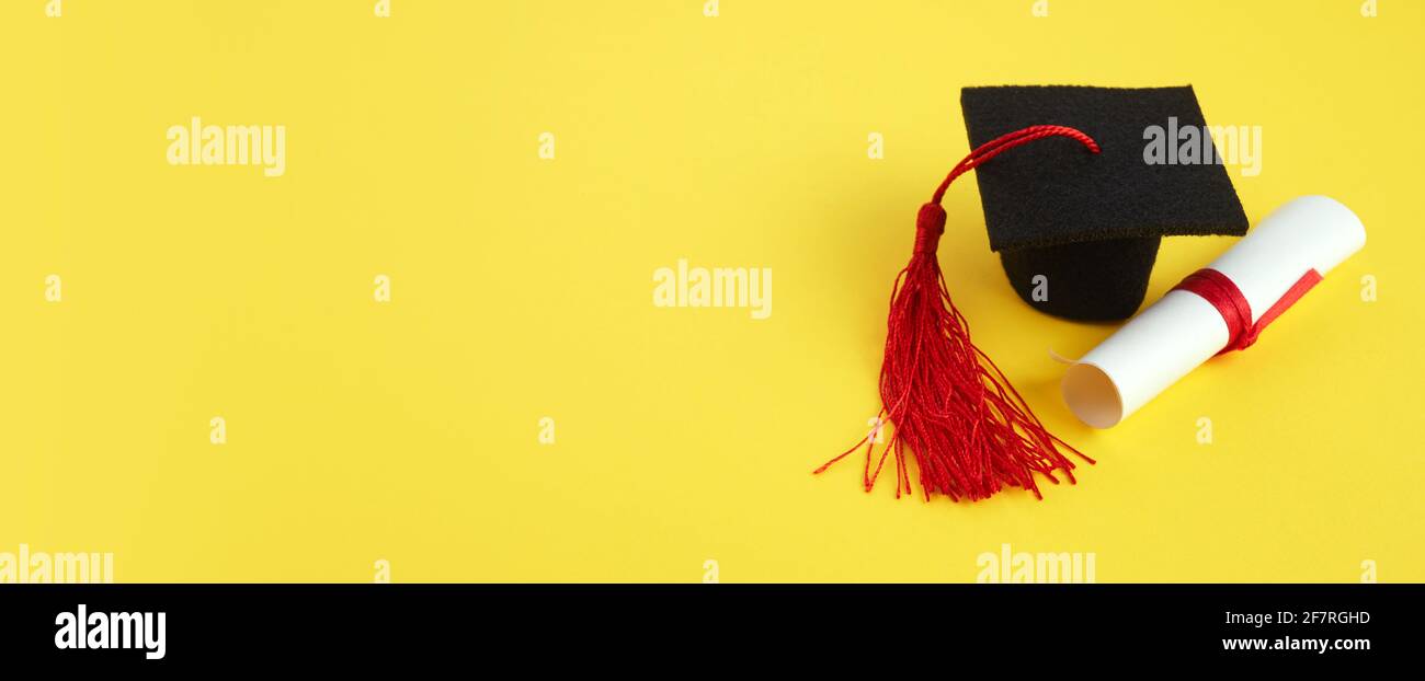 Academic hat with diploma on yellow background. Graduation theme Stock ...