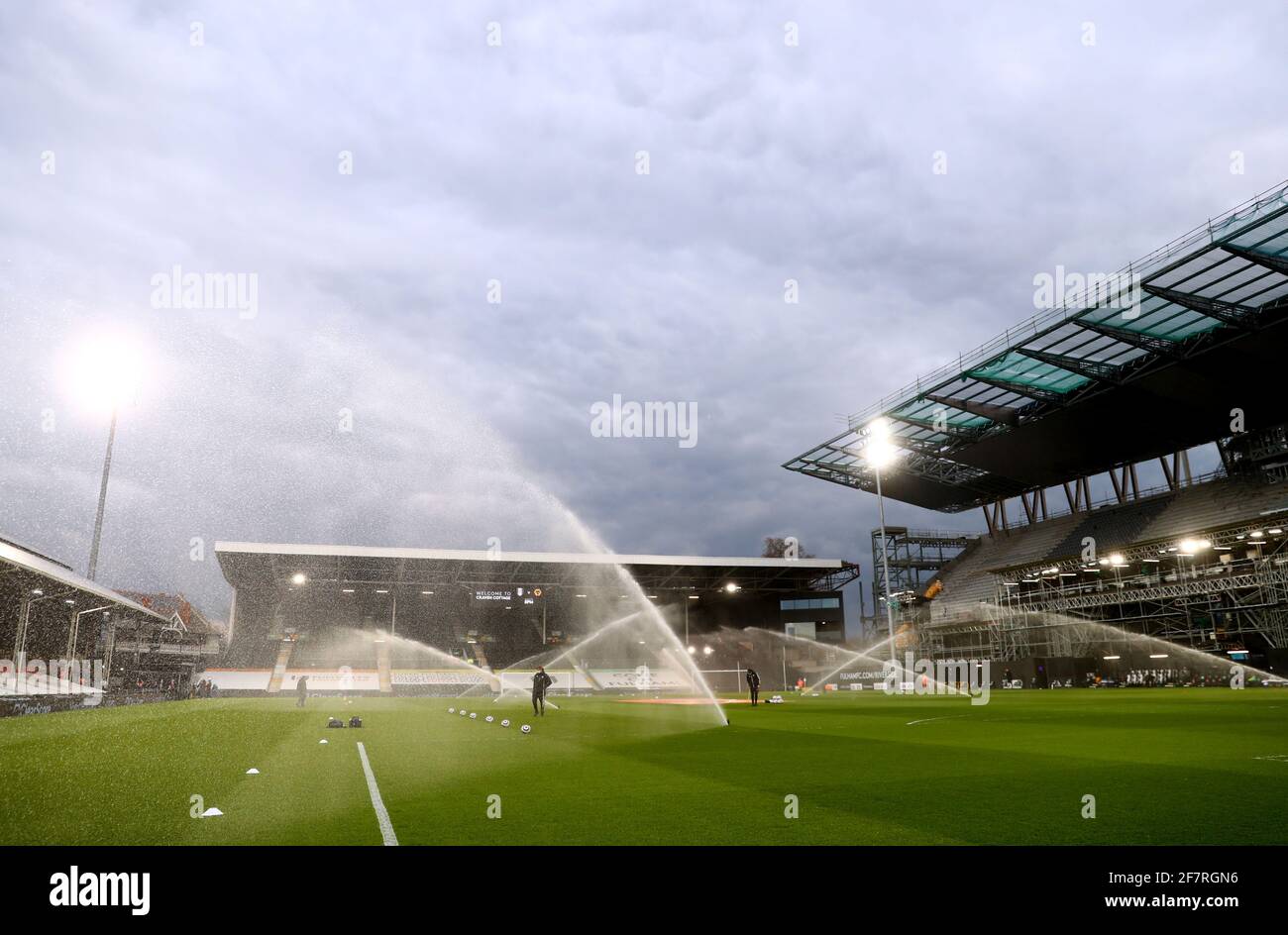 The sprinklers water the pitch at craven cottage hi-res stock ...