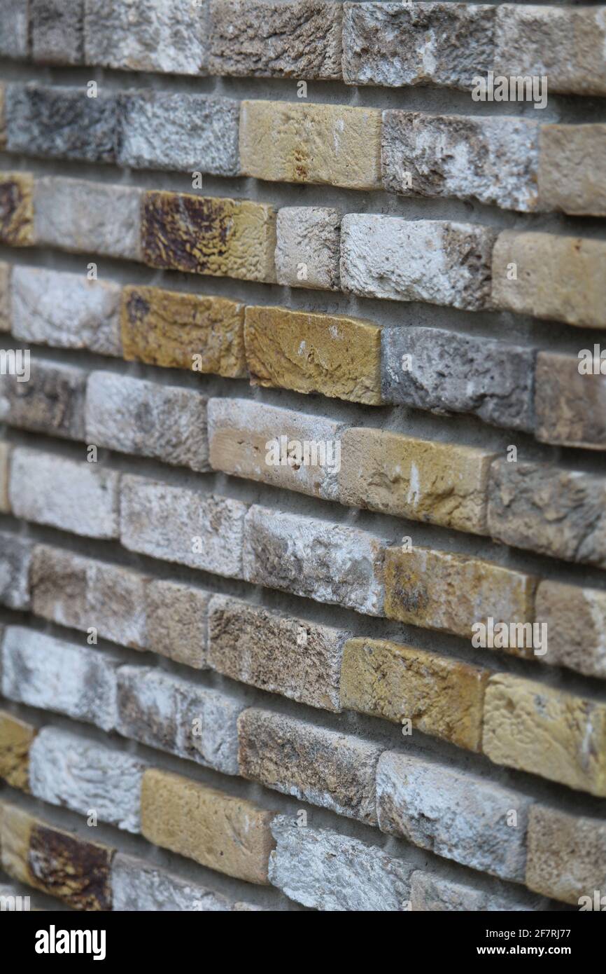 Vertical side view of an old weathered stone wall for backgrounds Stock ...