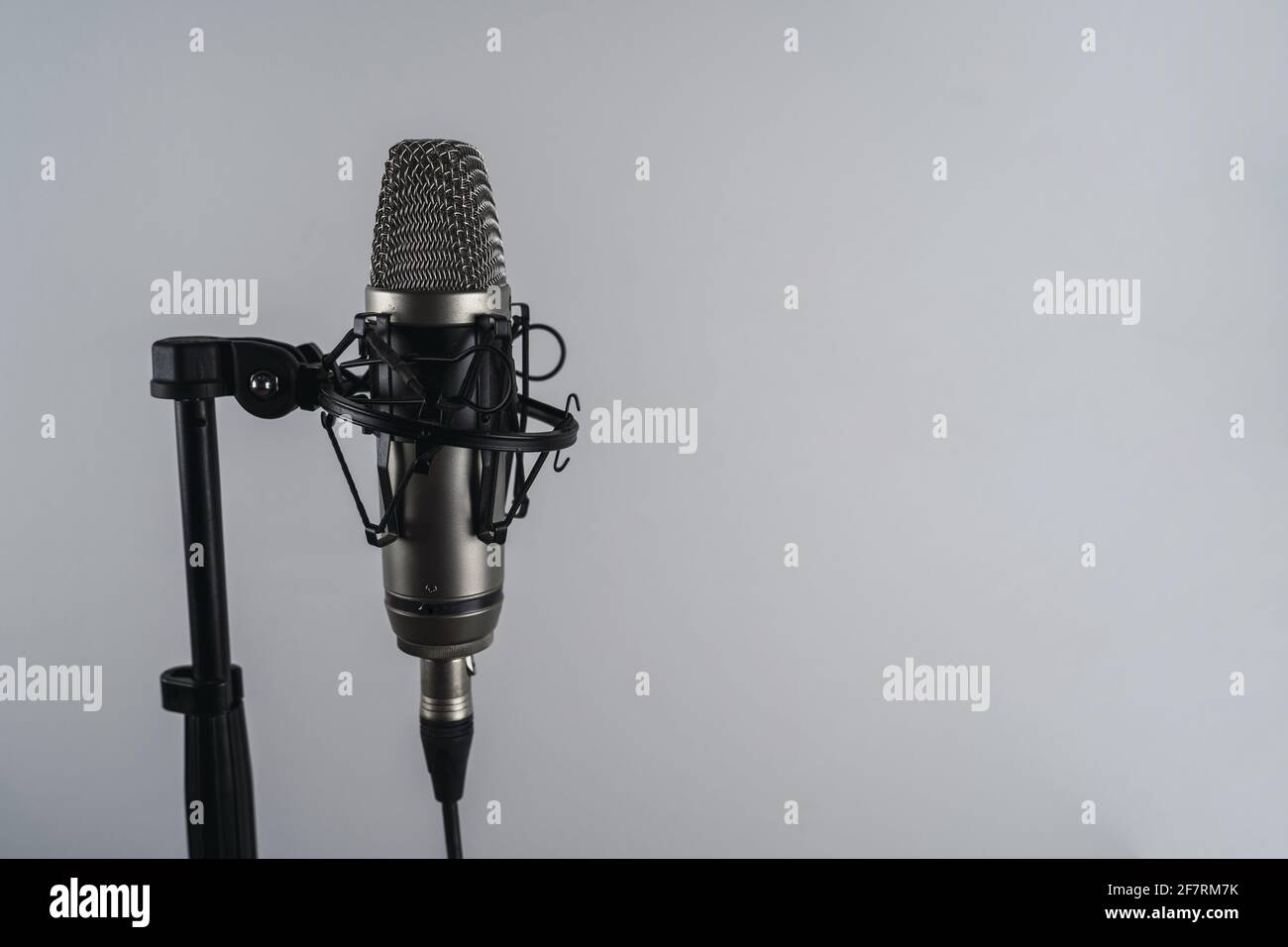 Microphone with wires in a studio against a white background Stock ...