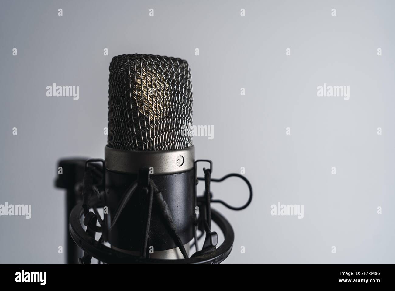 Microphone with wires in a studio against a white background Stock ...
