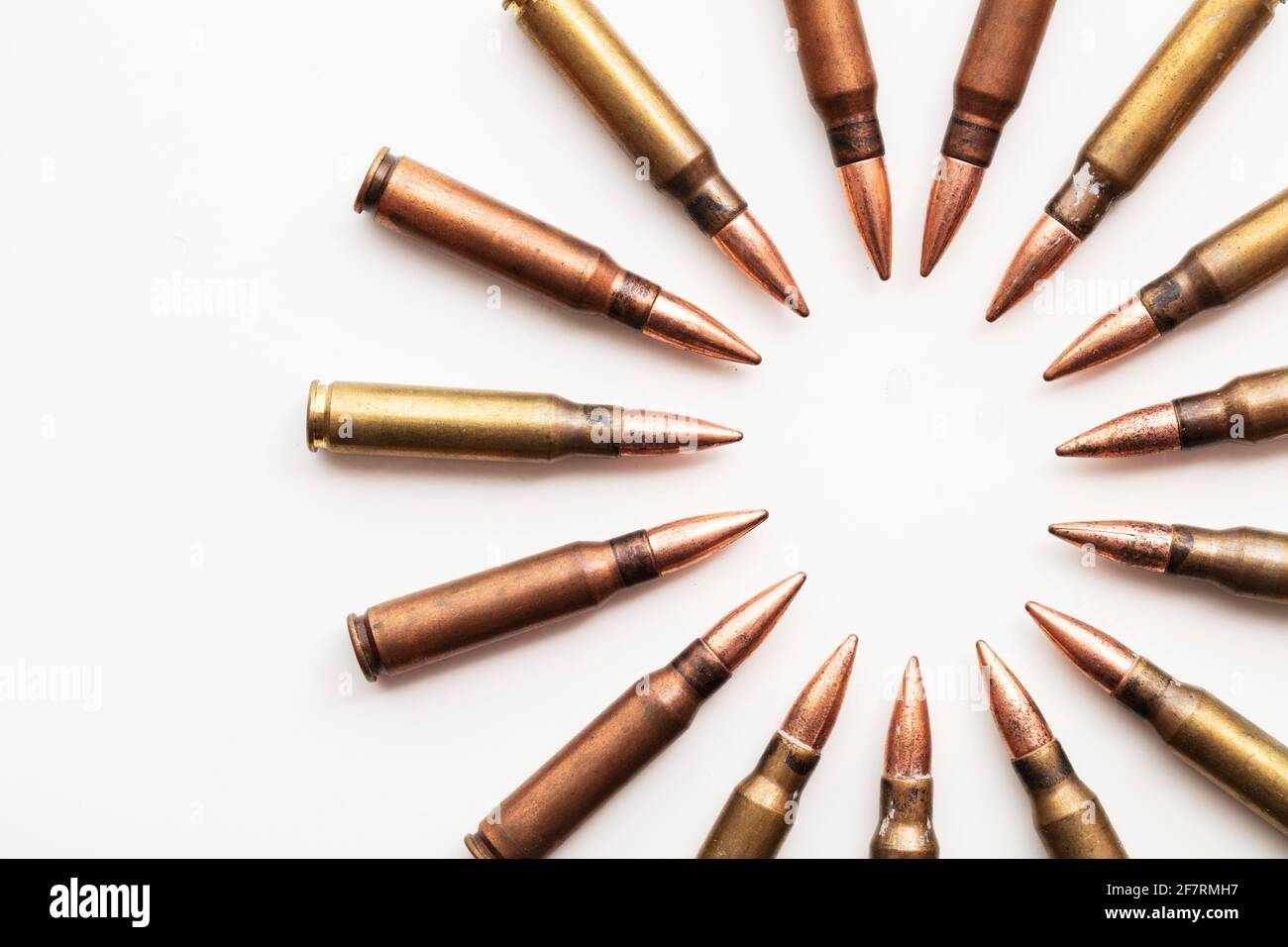 A group of bullet ammunition shells in a circle on a white background ...