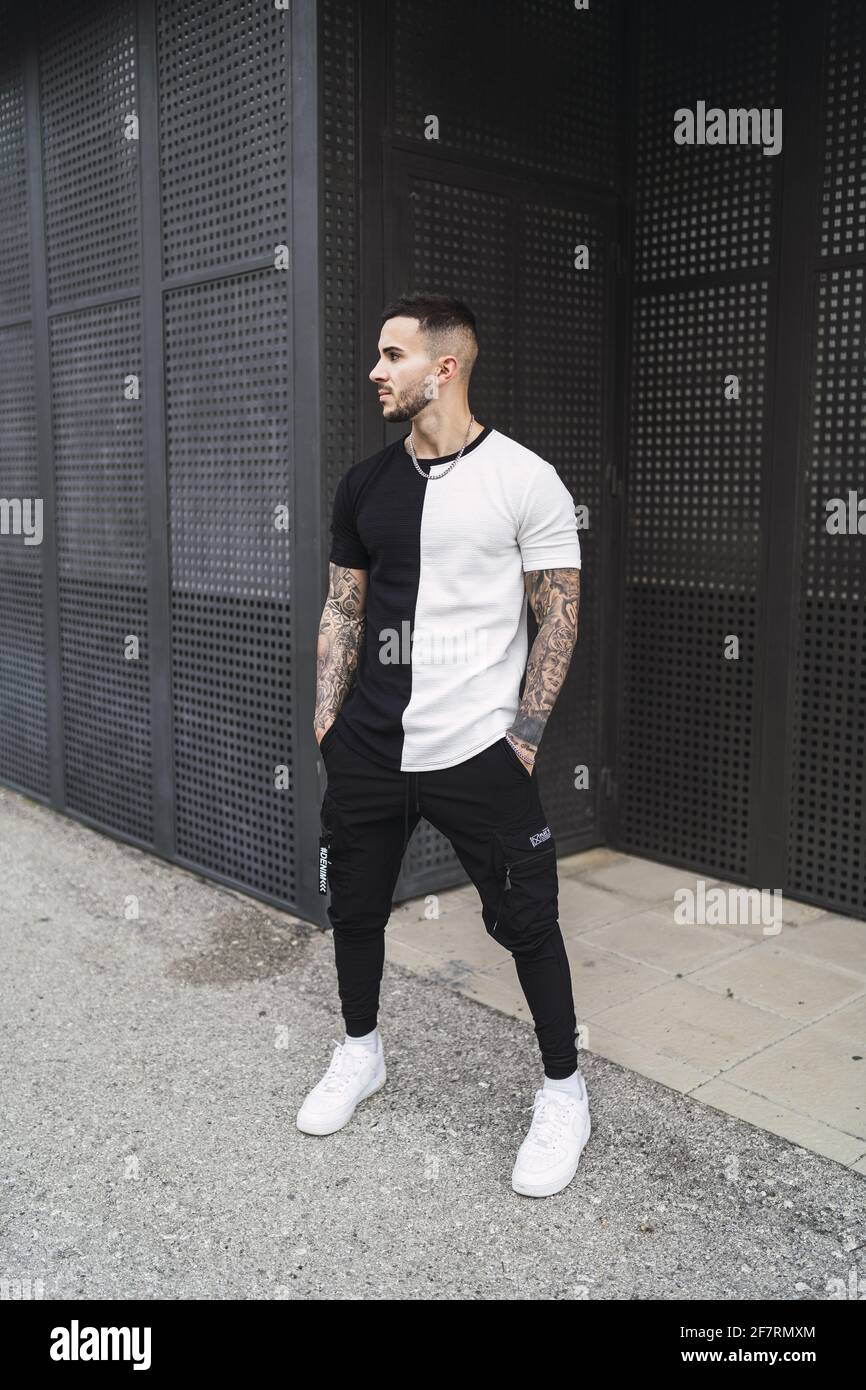 Vertical shot of a handsome Spanish male posing outdoors Stock Photo ...
