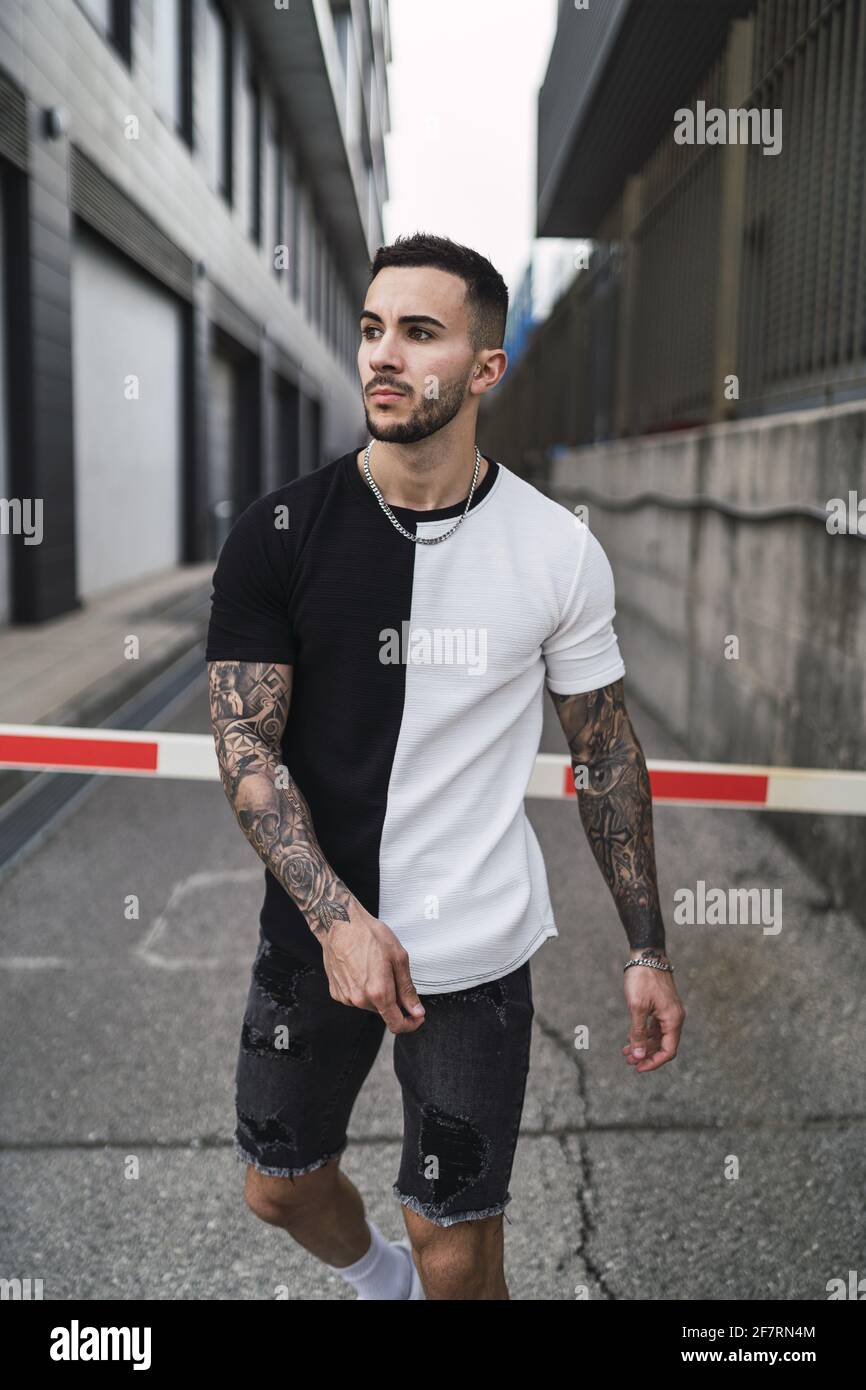 Vertical shot of a handsome Spanish male posing outdoors Stock Photo ...