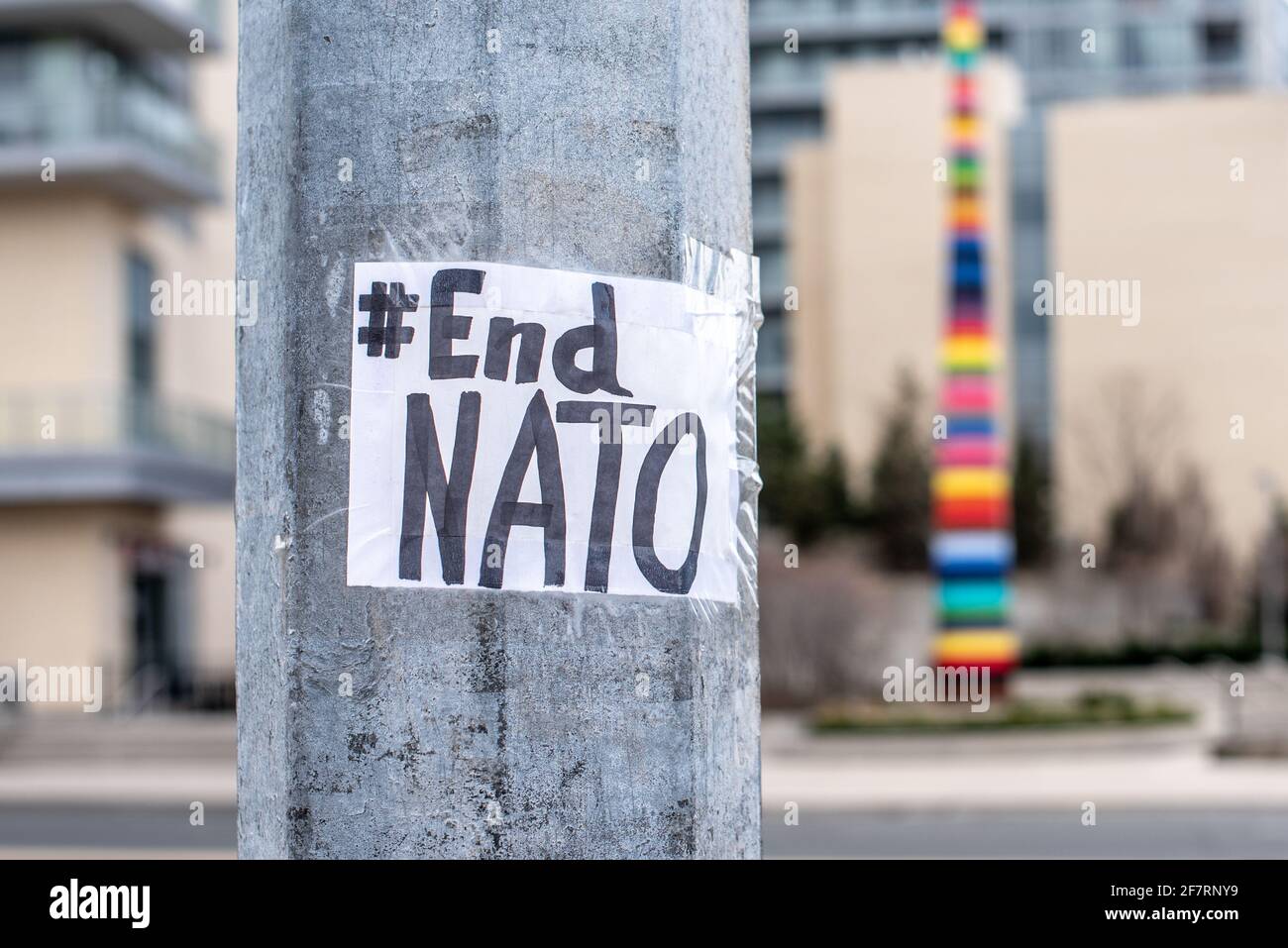 Sign reading End Nato in a city lamp post in Toronto, Canada Stock ...