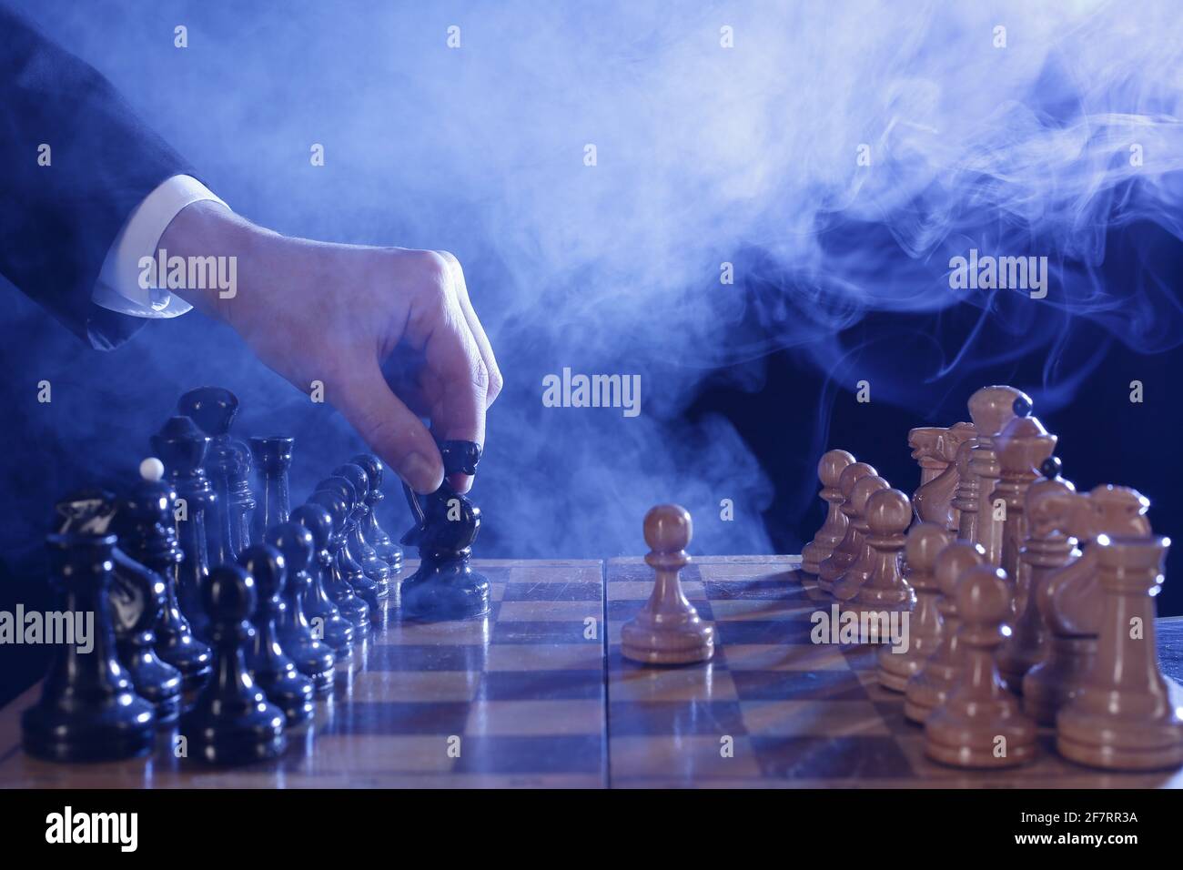 Person moving a chess piece hi-res stock photography and images - Alamy