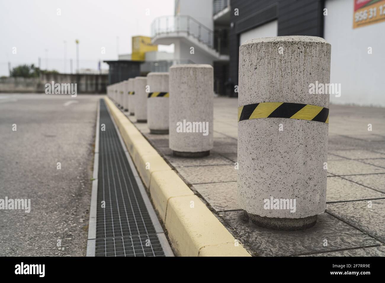 Street with concrete bollards Stock Photo - Alamy