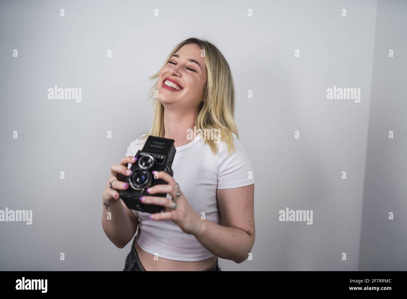 Smiling spanish female holding hi-res stock photography and images - Alamy